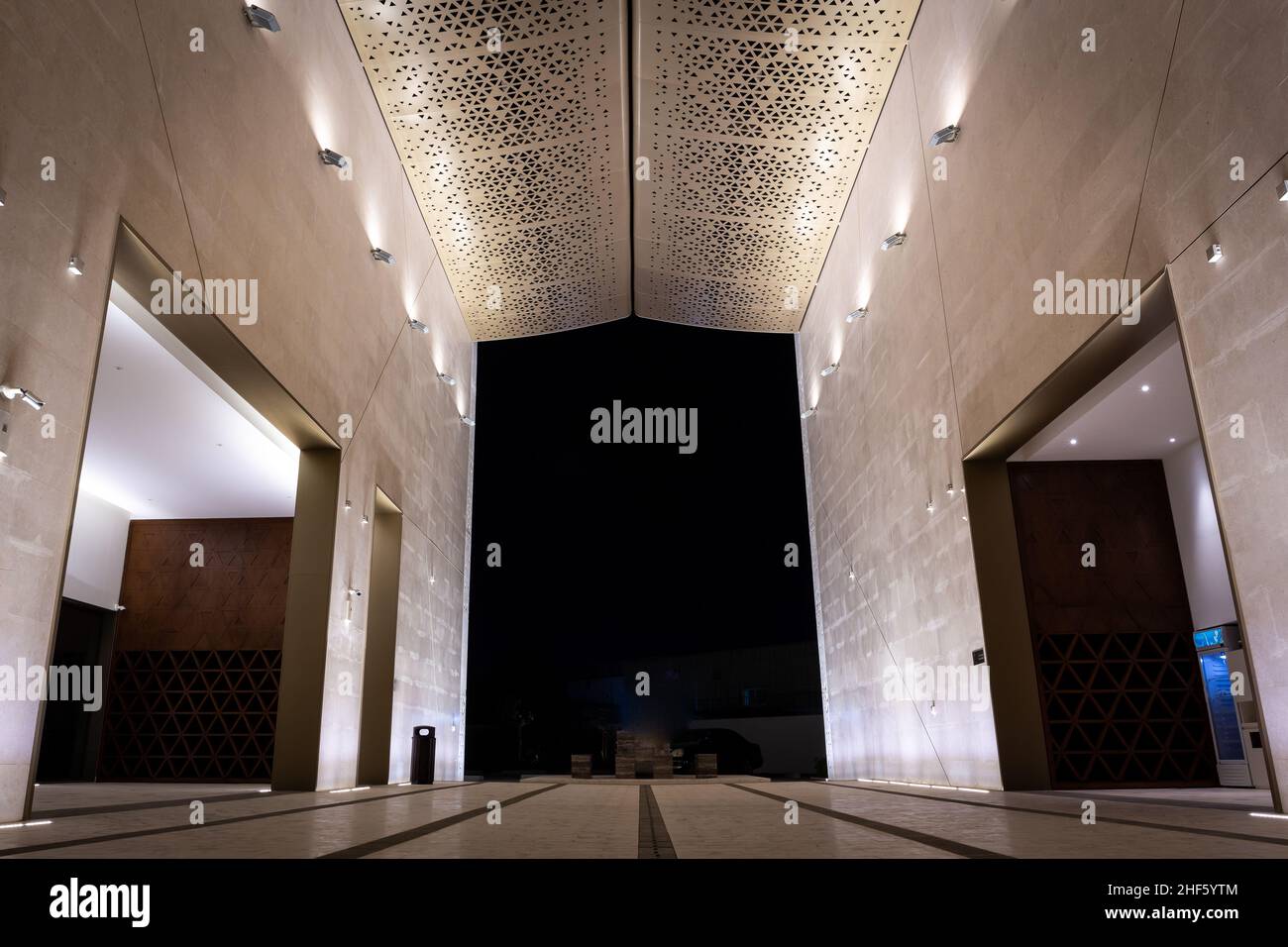 Illuminated courtyard of Mosque of Light in Dubai, facade and roof with ...