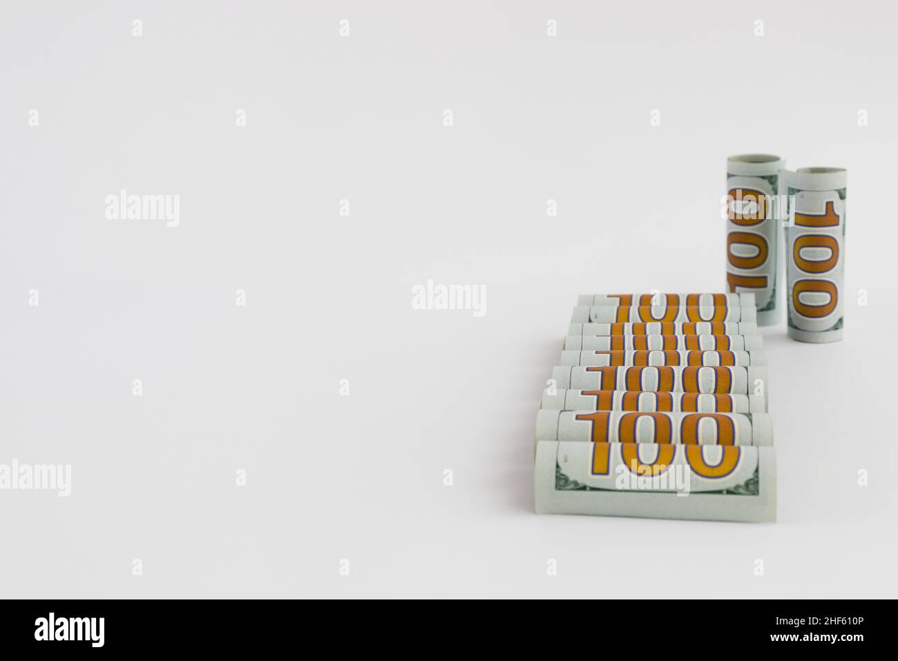 Rolled dollars on white with copy space. American money Stock Photo - Alamy
