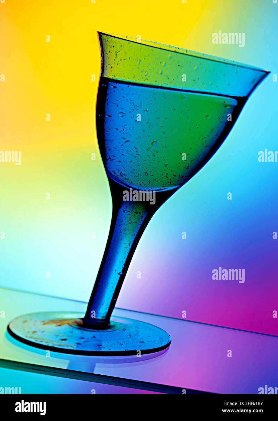 A colourful bendy distorted surreal wine glass photographed using an ...