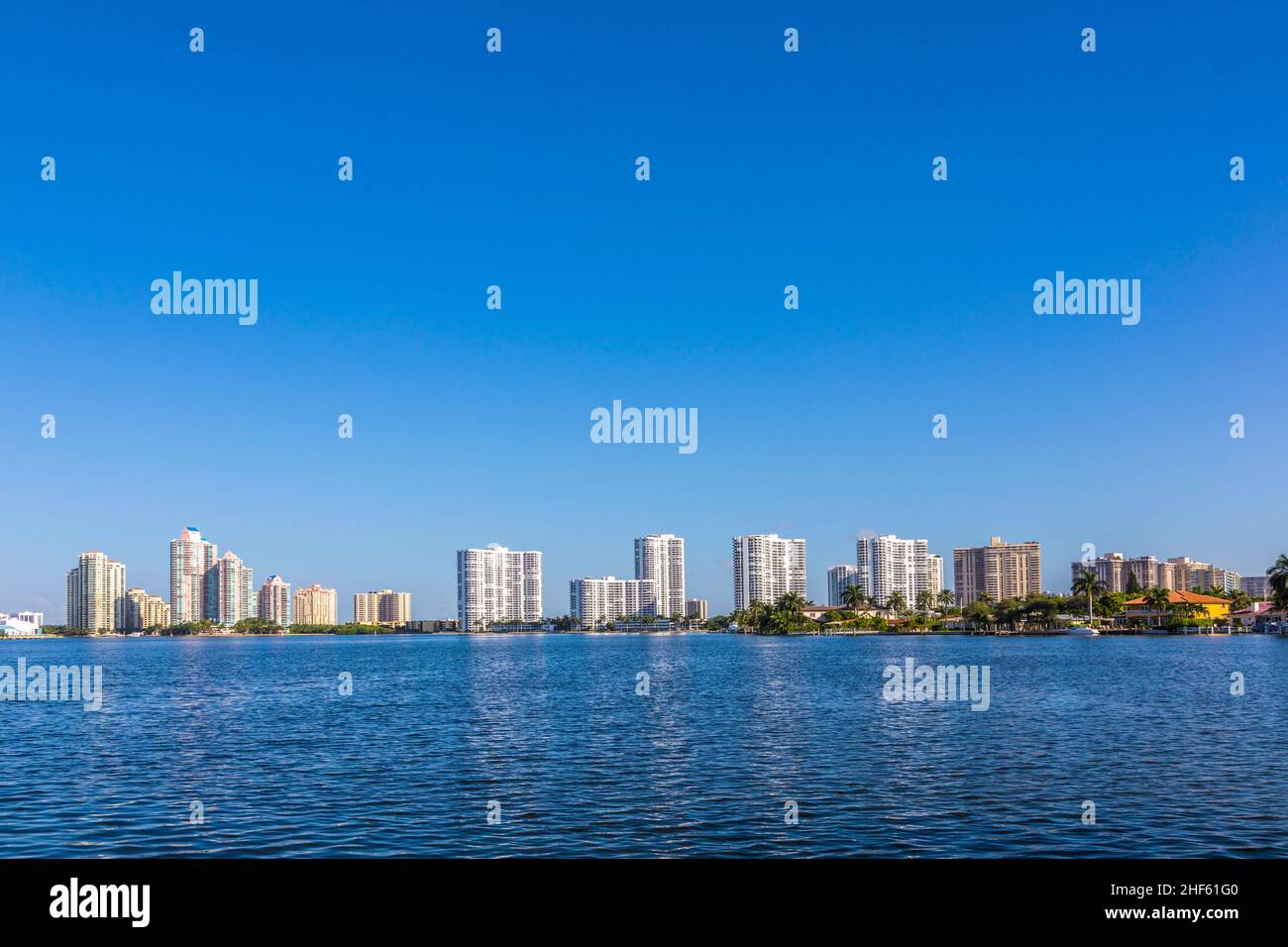 skyline of Miami with ocean under blue sky Stock Photo - Alamy
