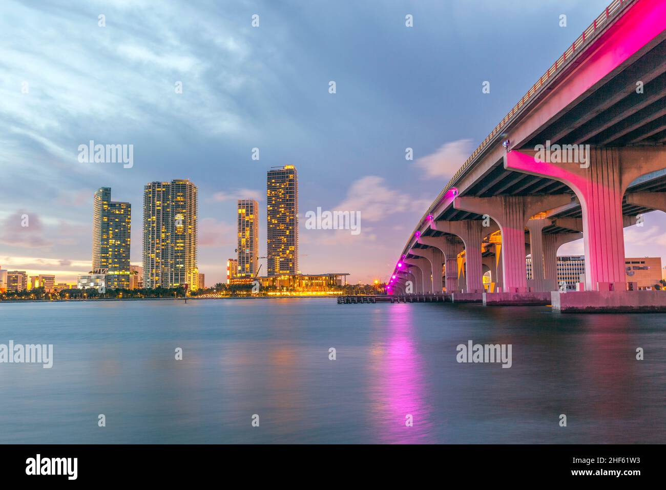 Miami city skyline panorama at dusk with urban skyscrapers and bridge ...