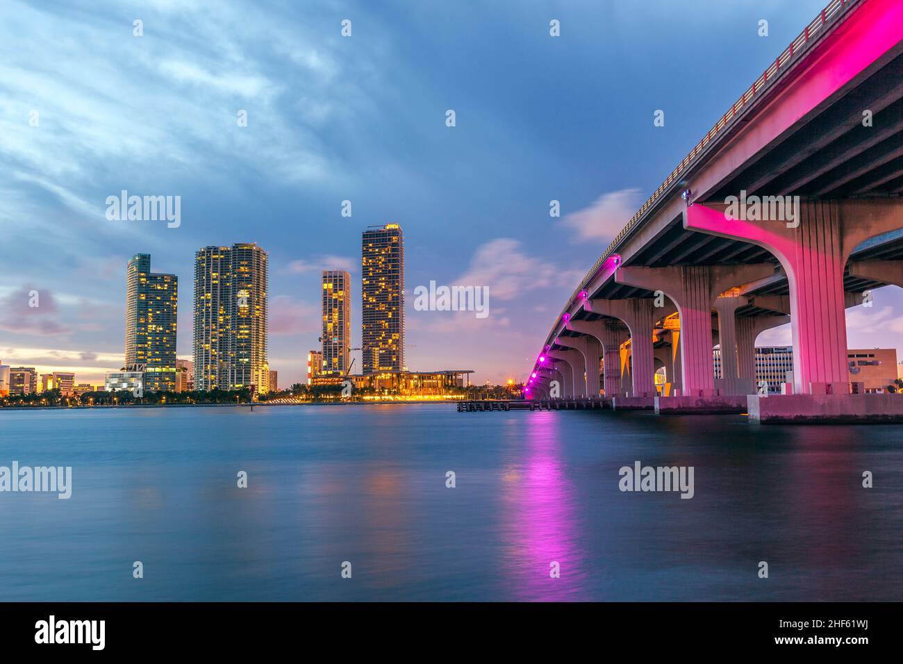 Miami city skyline panorama at dusk with urban skyscrapers and bridge ...