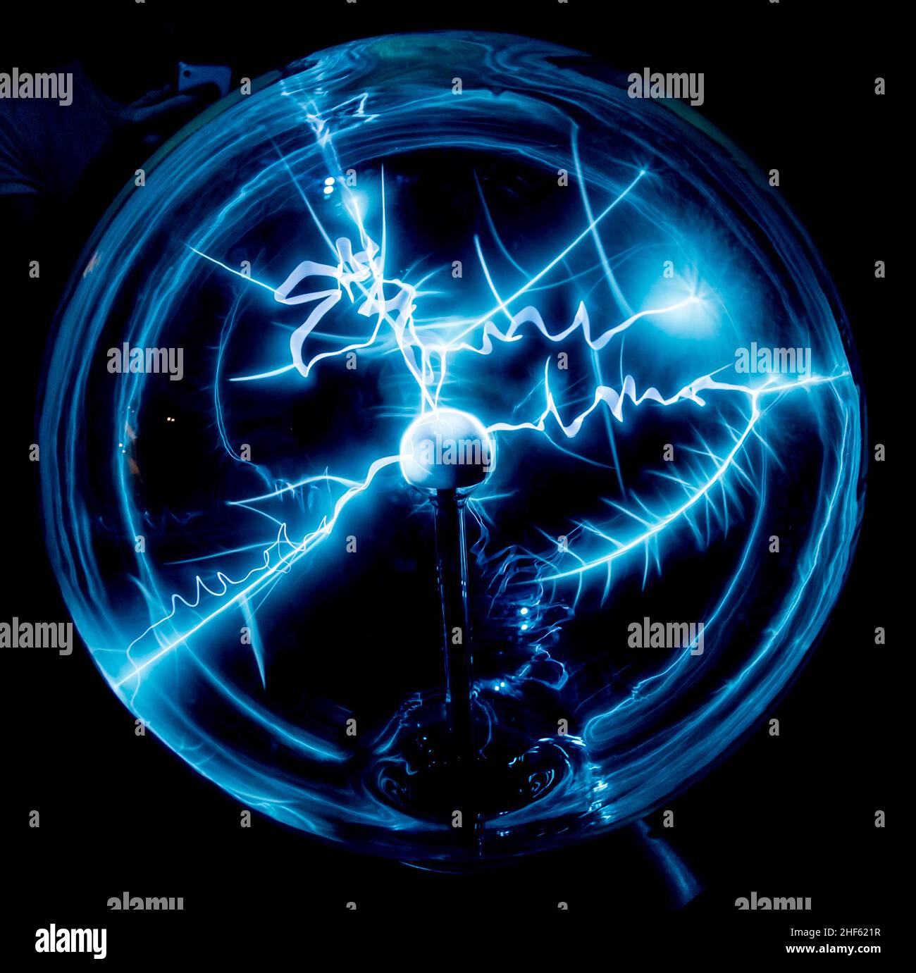 Electricity in a plasma ball as high voltage lightning Stock Photo - Alamy
