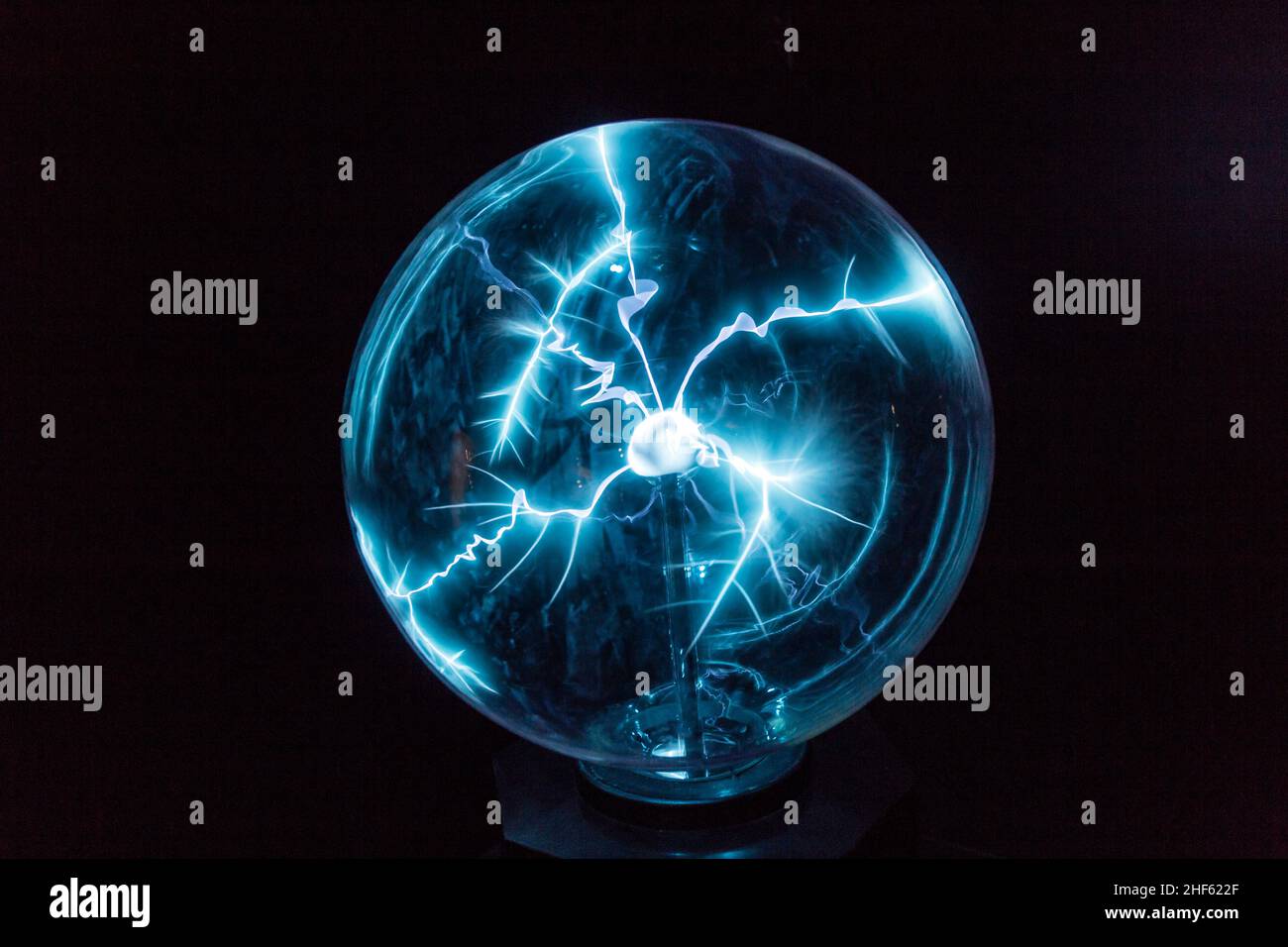 Electricity in a plasma ball as high voltage lightning Stock Photo - Alamy