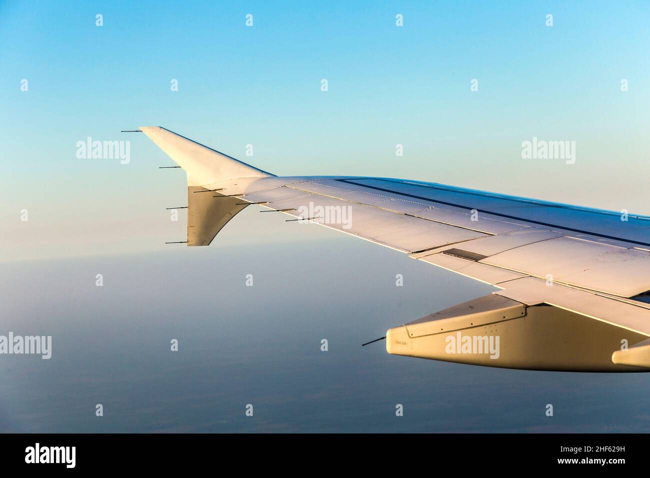 Wing of airplane from window Stock Photo - Alamy