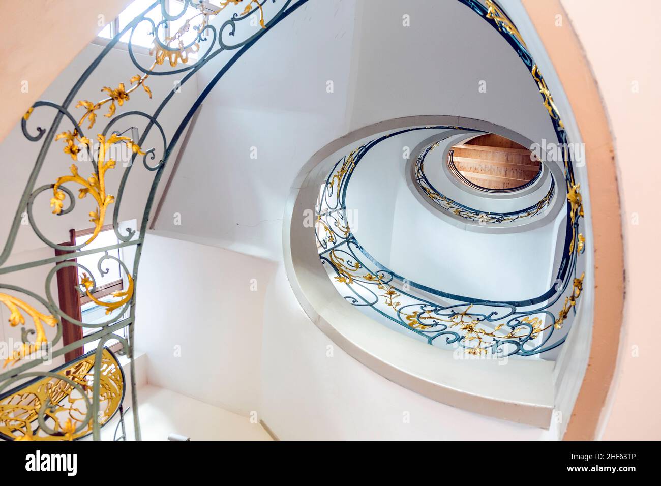 public spiral staircase in an old house Stock Photo - Alamy