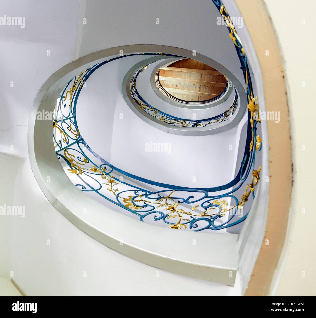public spiral staircase in an old house Stock Photo - Alamy