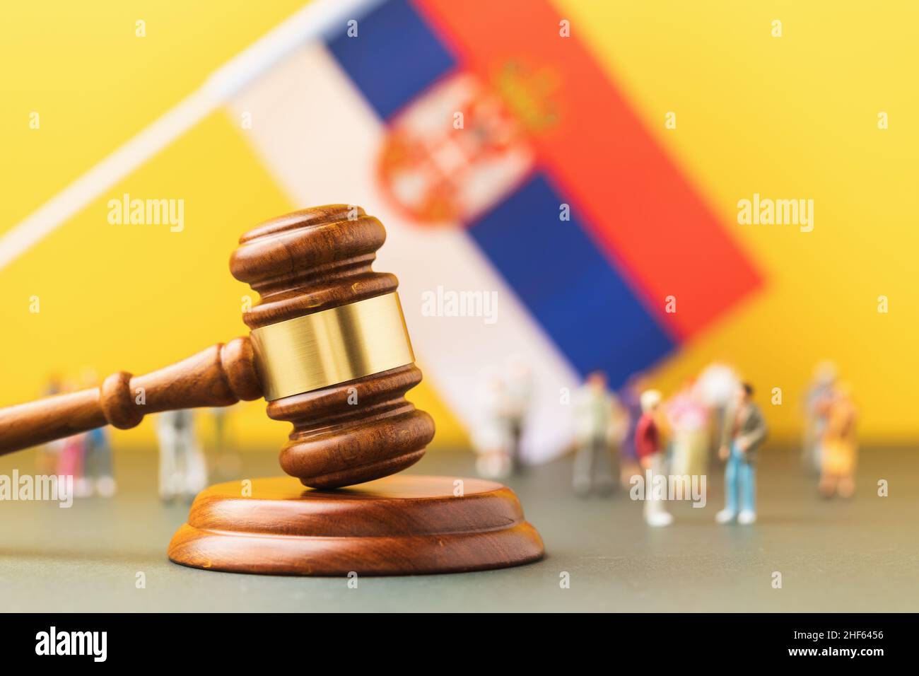 Judge gavel, flag and plastic toy men on colored background, Serbia ...