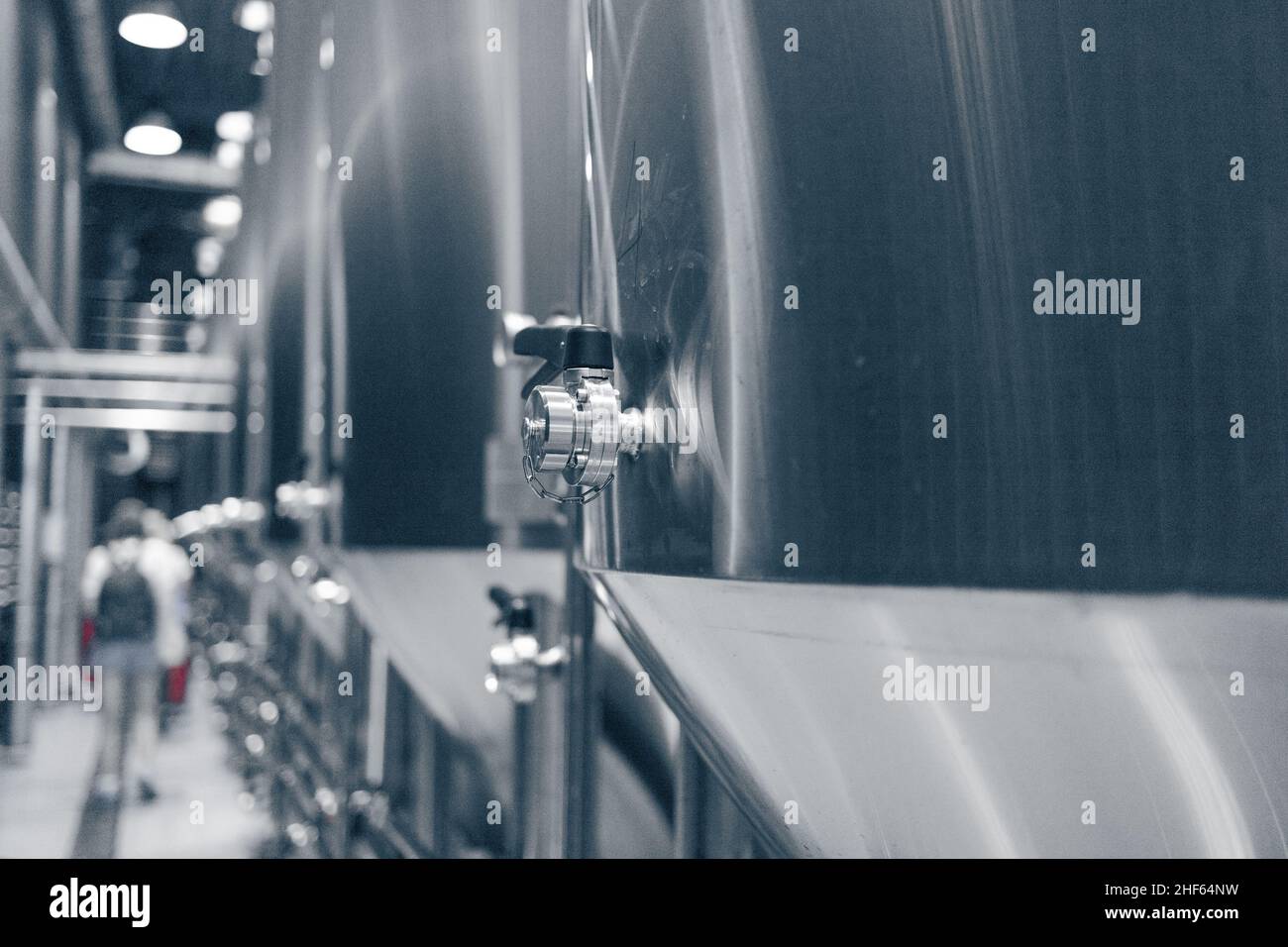 Private microbrewery. Modern beer plant with brewering kettles, tubes ...