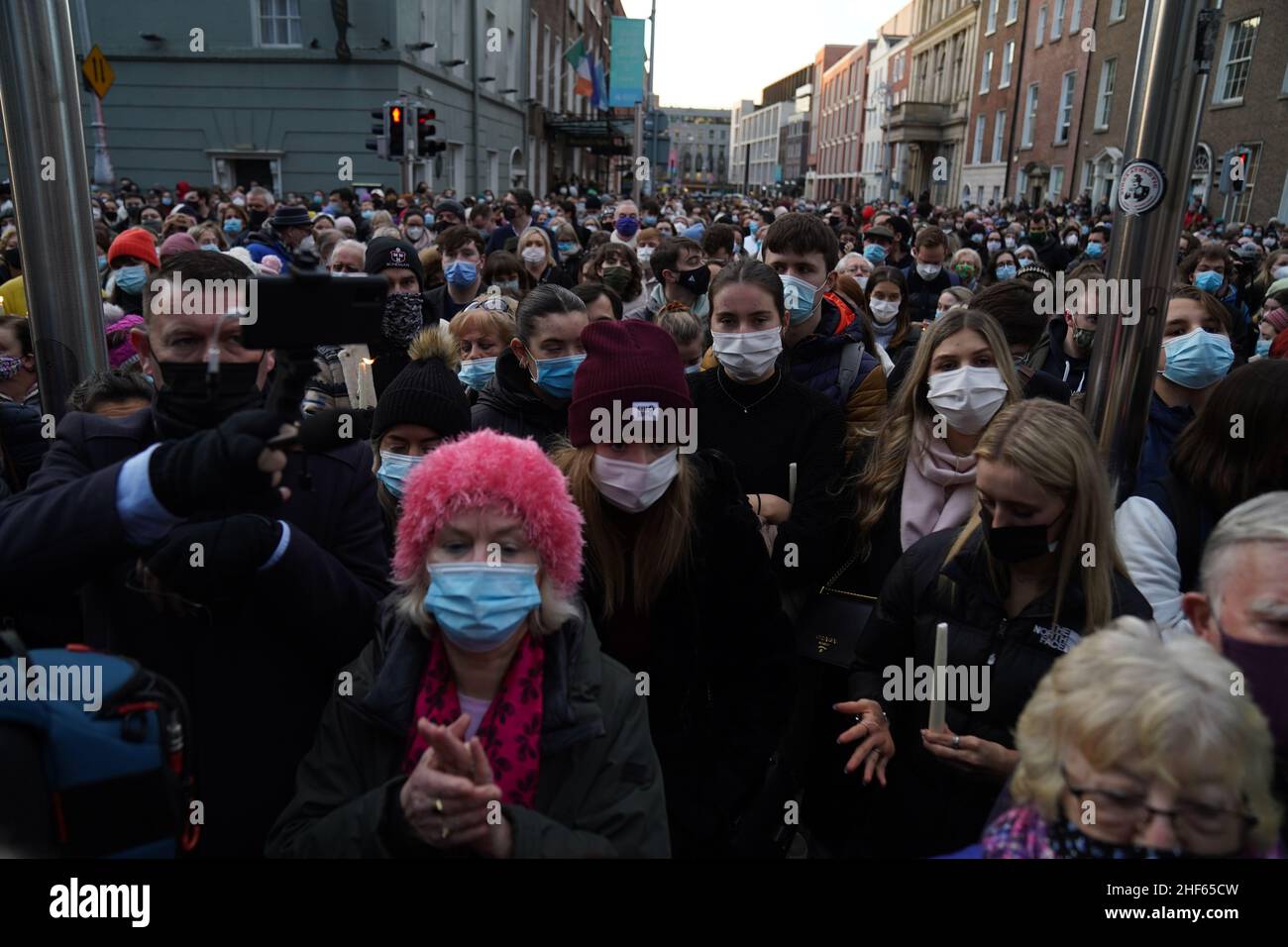 People attending a vigil at Leinster House, Dublin, for the murdered ...