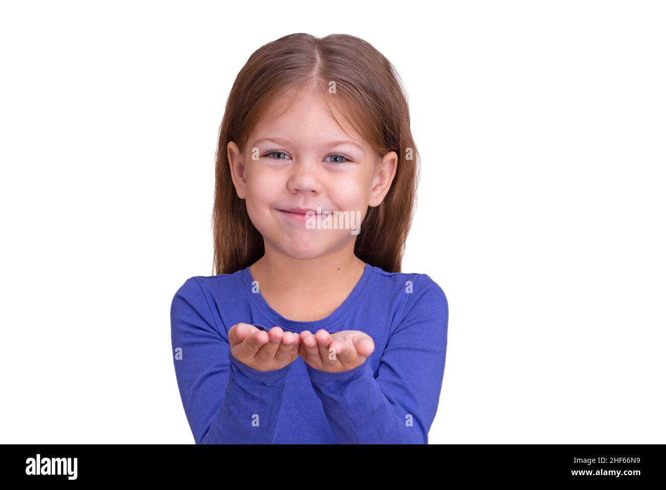 Cute smiling with kind look holding hands showing something, you could ...