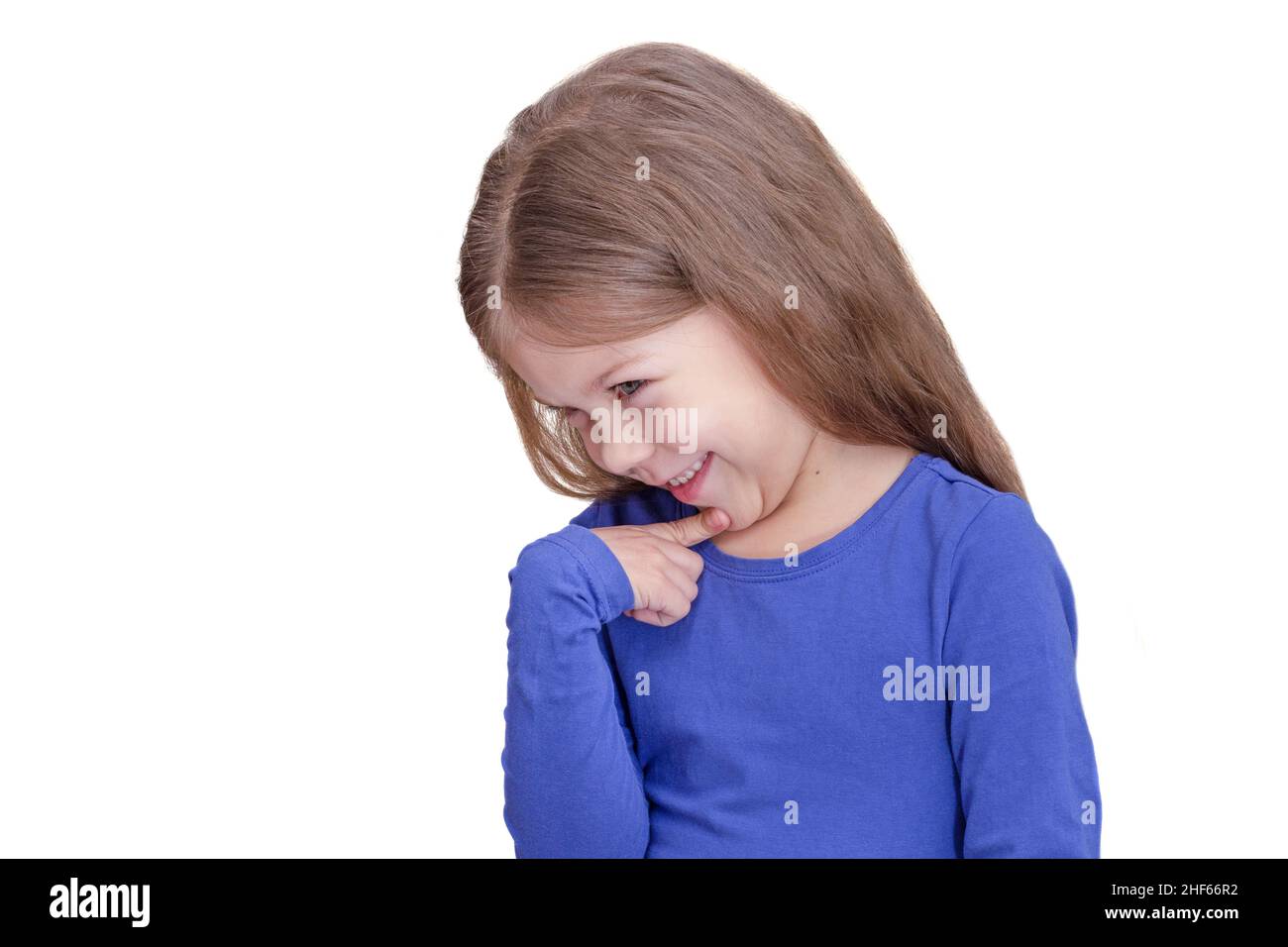 Shying child kid holding finger on chin isolated on white background ...