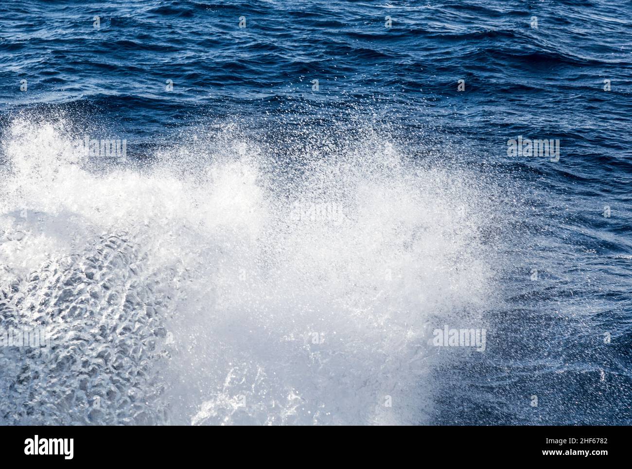 wave pattern from a boat in the ocean Stock Photo - Alamy