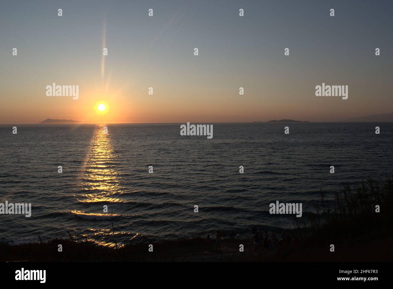 Sunset at Logas Beach at Peroulades, Corfu Island Stock Photo - Alamy