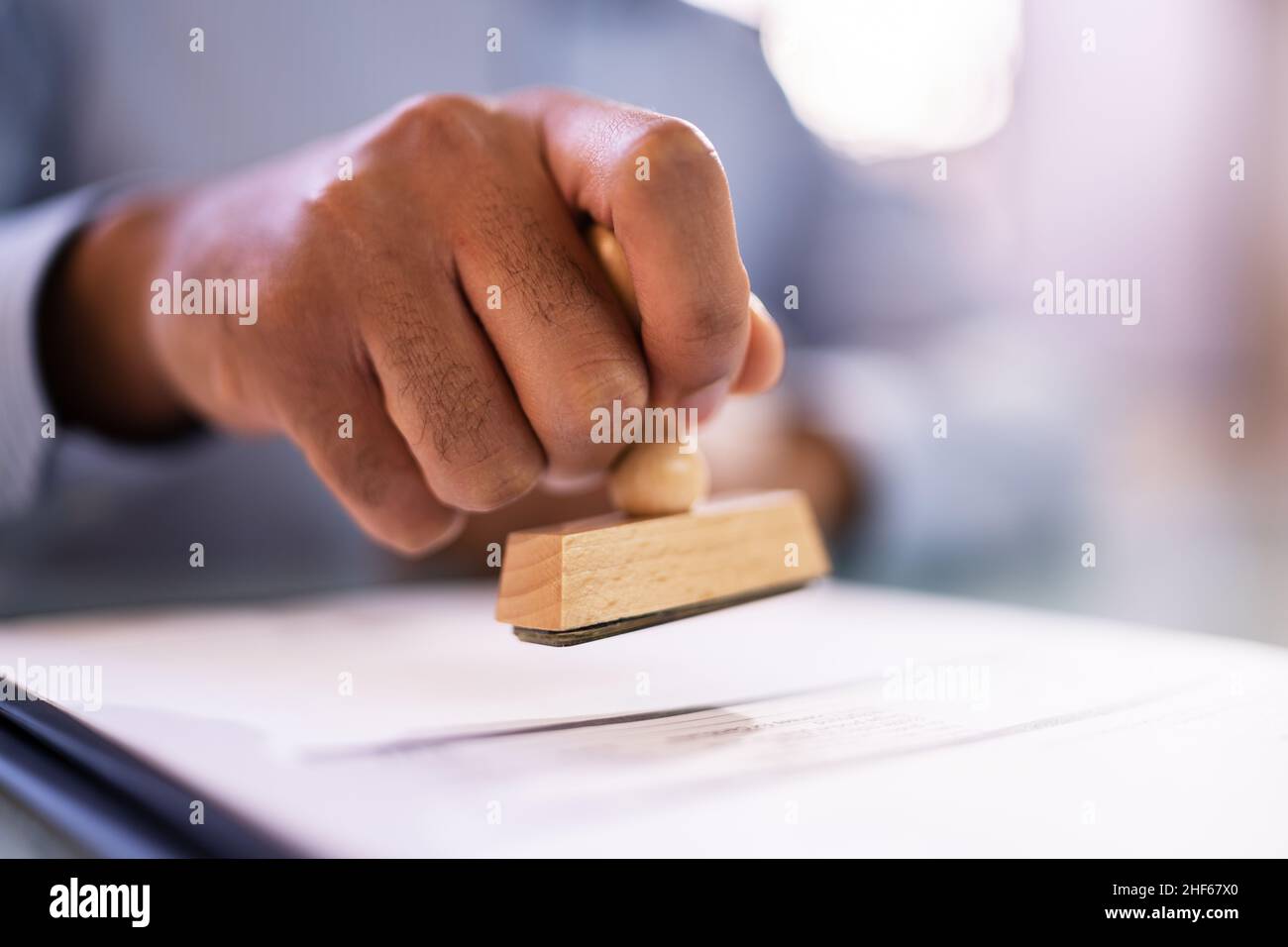 Public Notary Putting Company Stamp On Contract At Office Desk Stock ...