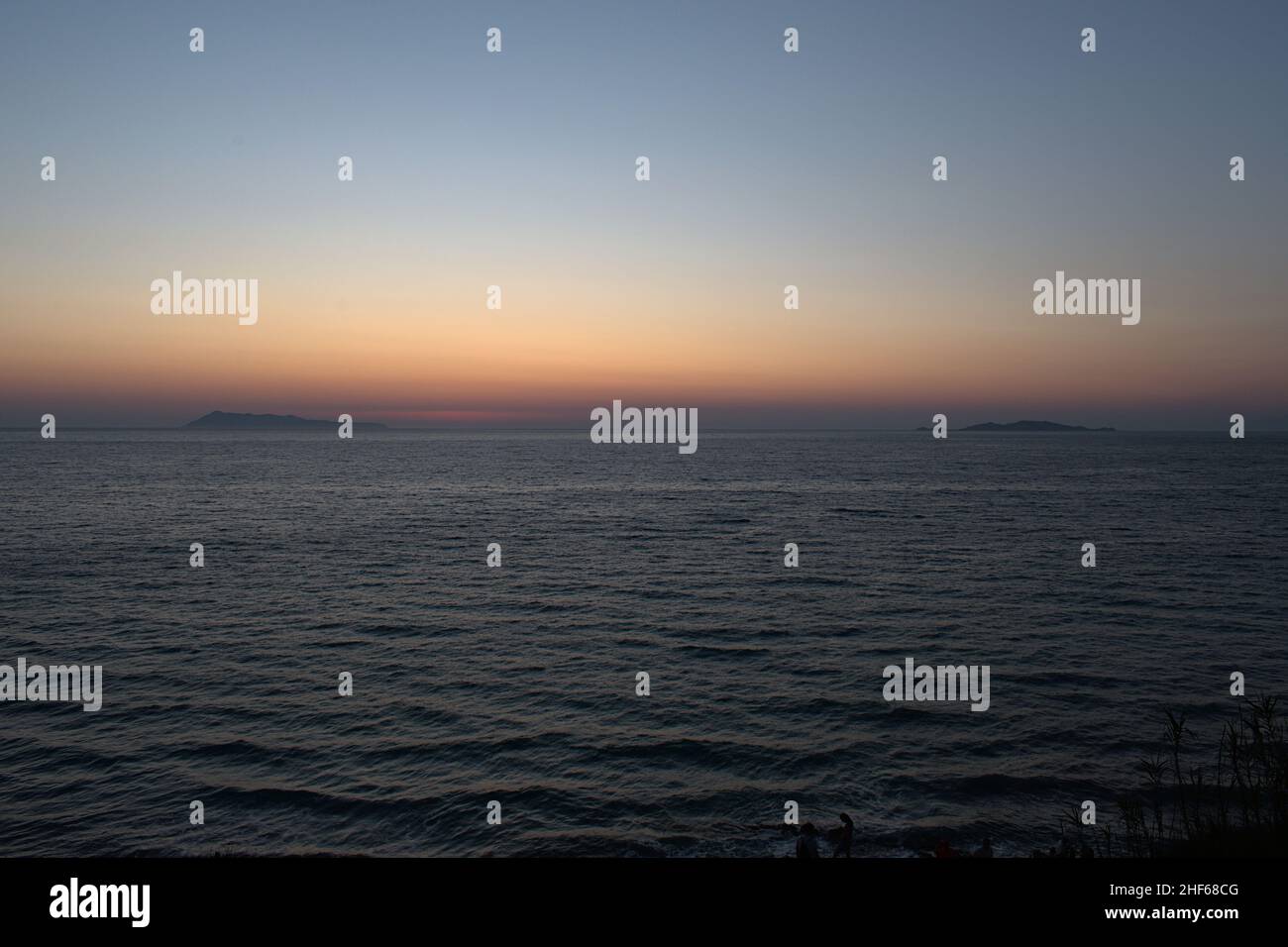 Sunset at Logas Beach at Peroulades, Corfu Island Stock Photo - Alamy