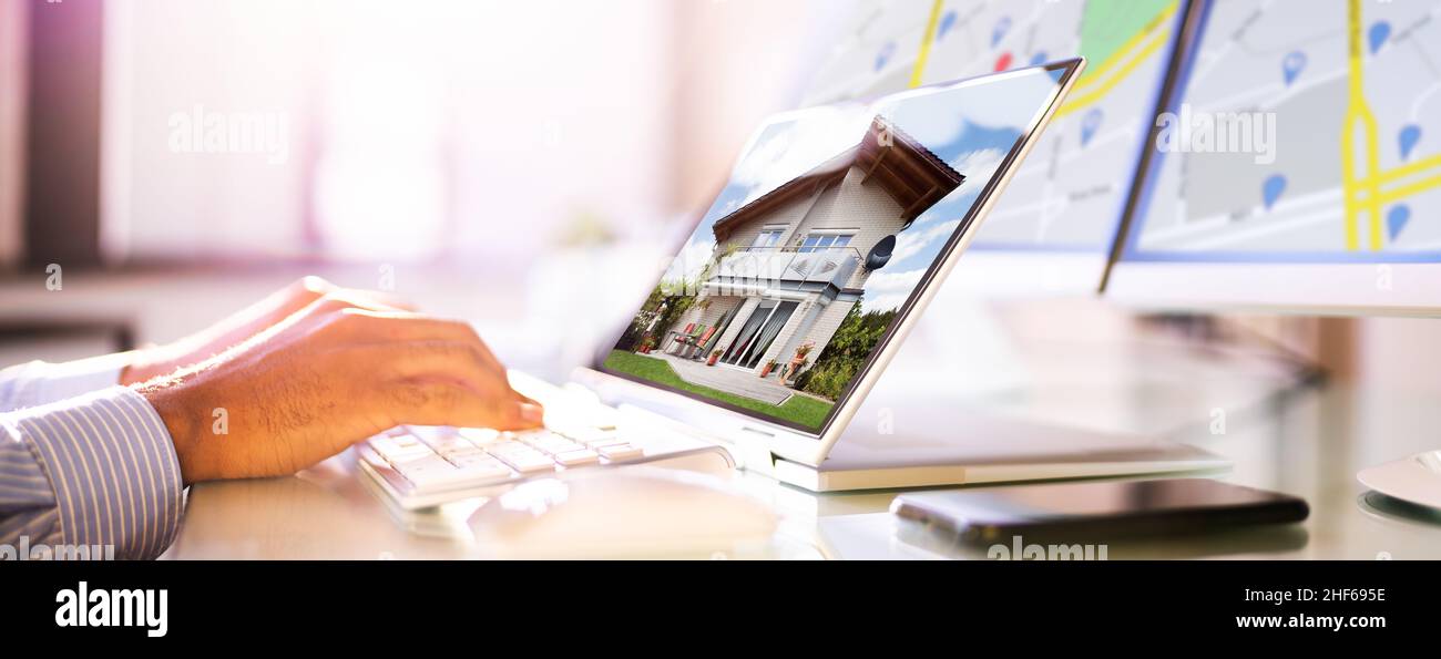African American Searching Real Estate House On Map Stock Photo - Alamy