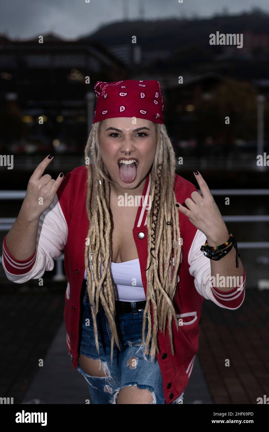 blonde woman with dreadlocks screaming and cheating Stock Photo - Alamy