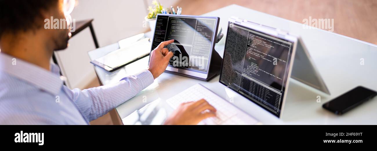 African American Coder Using Computer At Desk. Web Developer Stock Photo - Alamy