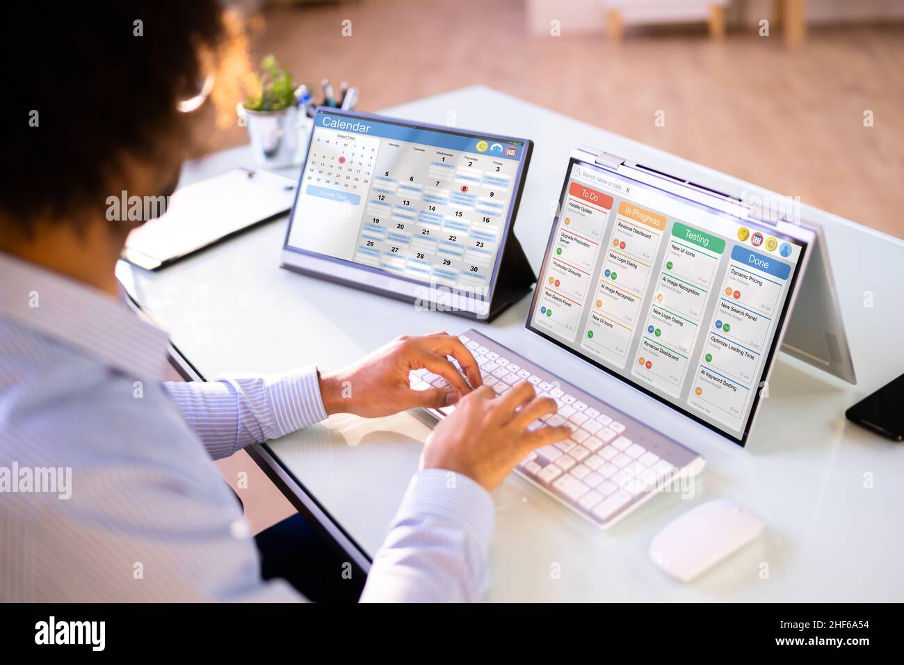 Calendar And Schedule List Chart On Multiple Computer Screens Stock ...