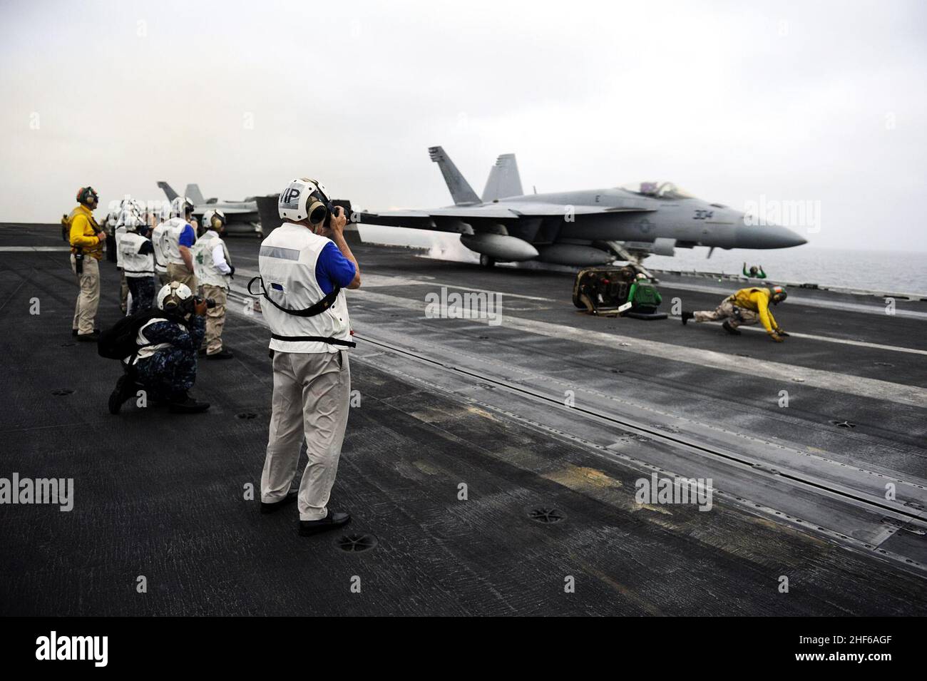 Secretary of the Navy Ray Mabus takes photos of flight operations on ...