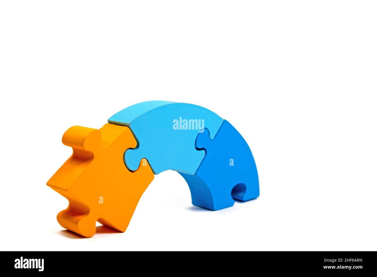 Three wooden puzzle pieces against a white background Stock Photo - Alamy