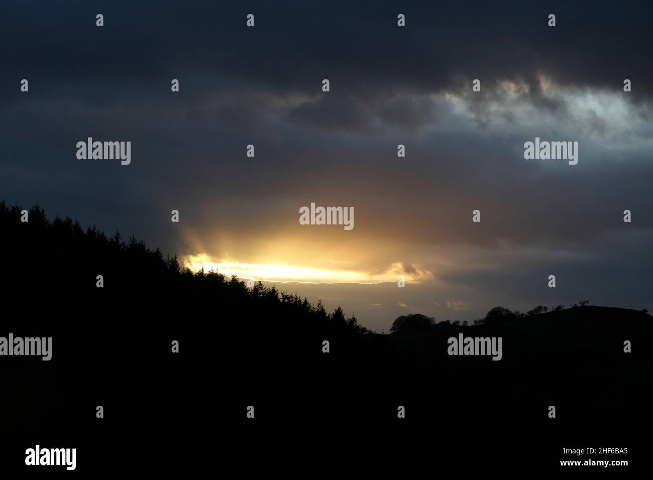 The sky cracked open and a beam of light shone through Stock Photo - Alamy