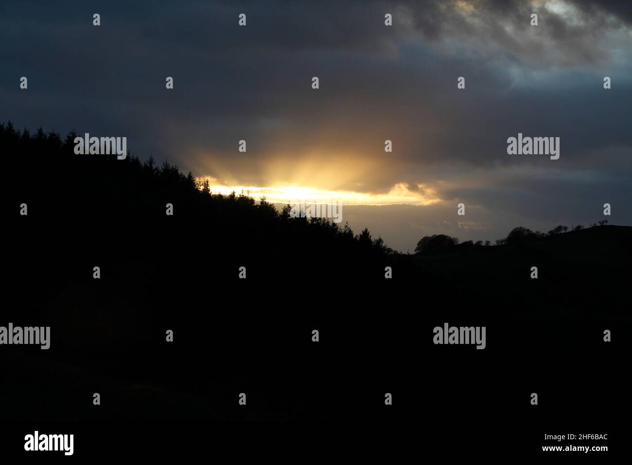 The sky cracked open and a beam of light shone through Stock Photo - Alamy