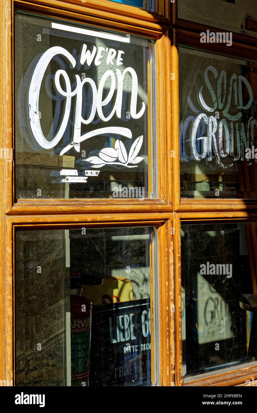 Cafe, window pane, lettering –€œWe–´re open–€ Stock Photo - Alamy