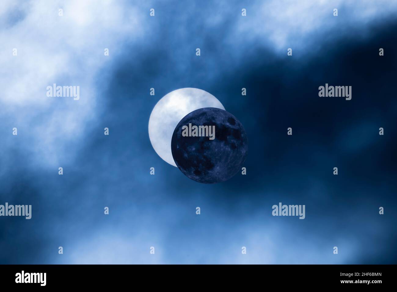 Solar eclipse in the sky with clouds of fog Stock Photo - Alamy