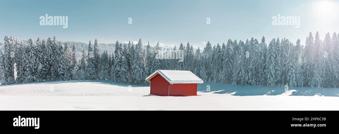 snow-covered red hut in a snowy winter landscape Stock Photo - Alamy