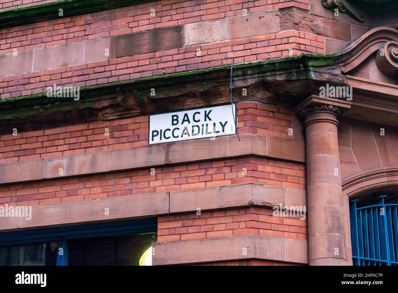 Back Piccadilly street sign on a white signpost in black lettering on a ...