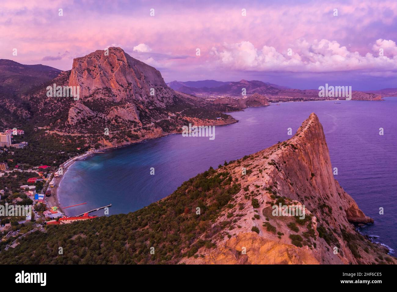 Pink sunset in Novyi Svit in autumn with mount Falcon in background ...