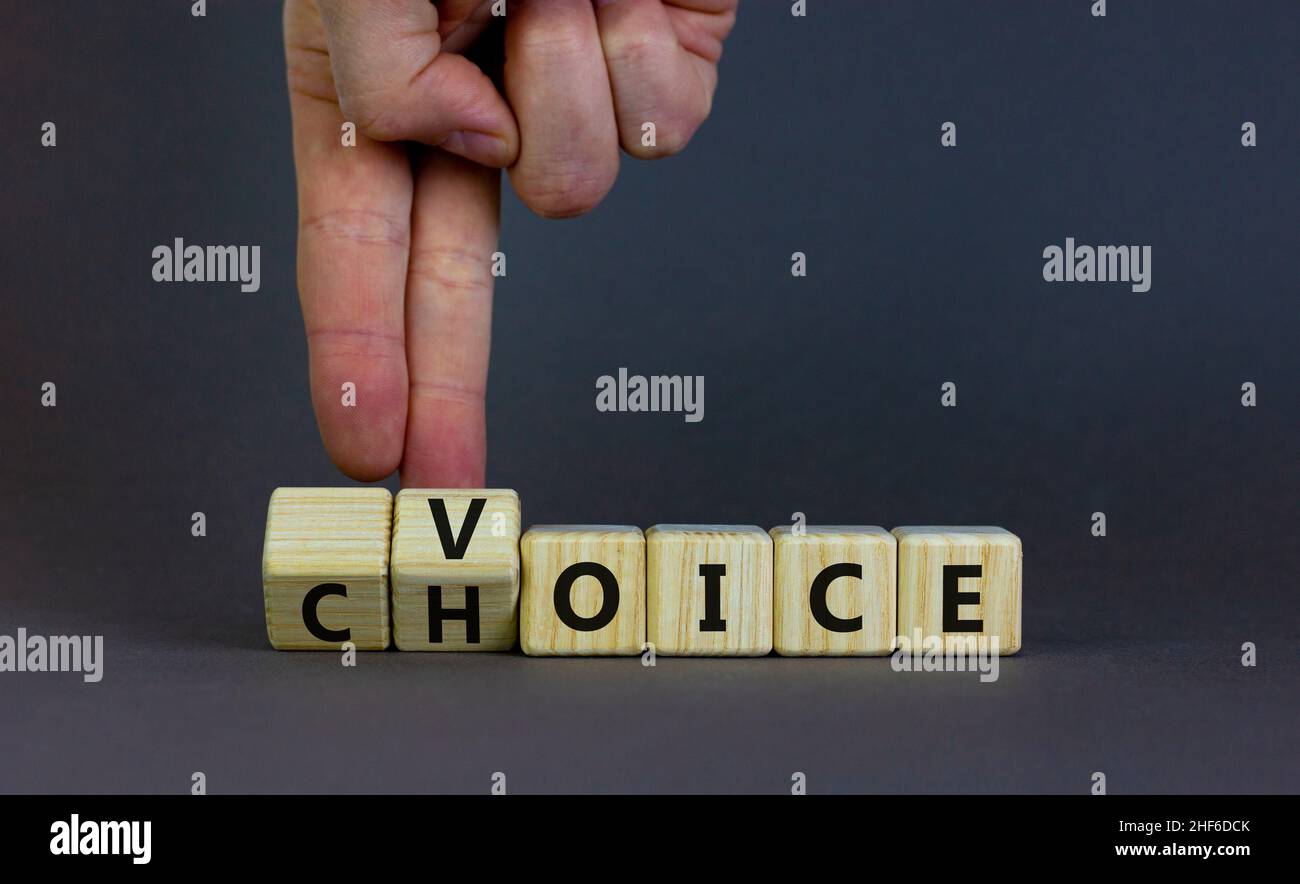 Voice and choice symbol. Businessman turns wooden cubes and changes the ...