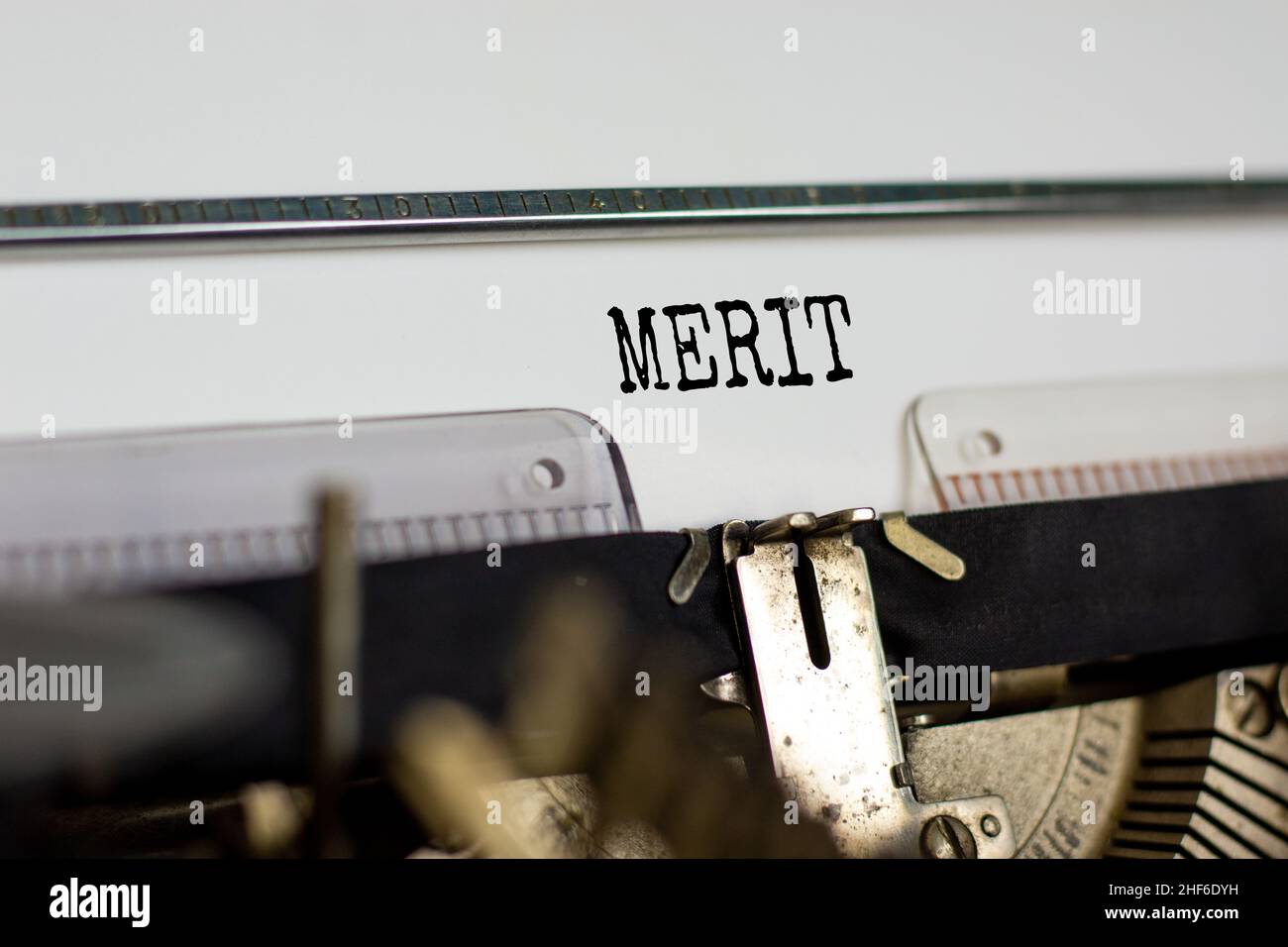 Merit symbol. The concept word merit typed on retro typewriter ...