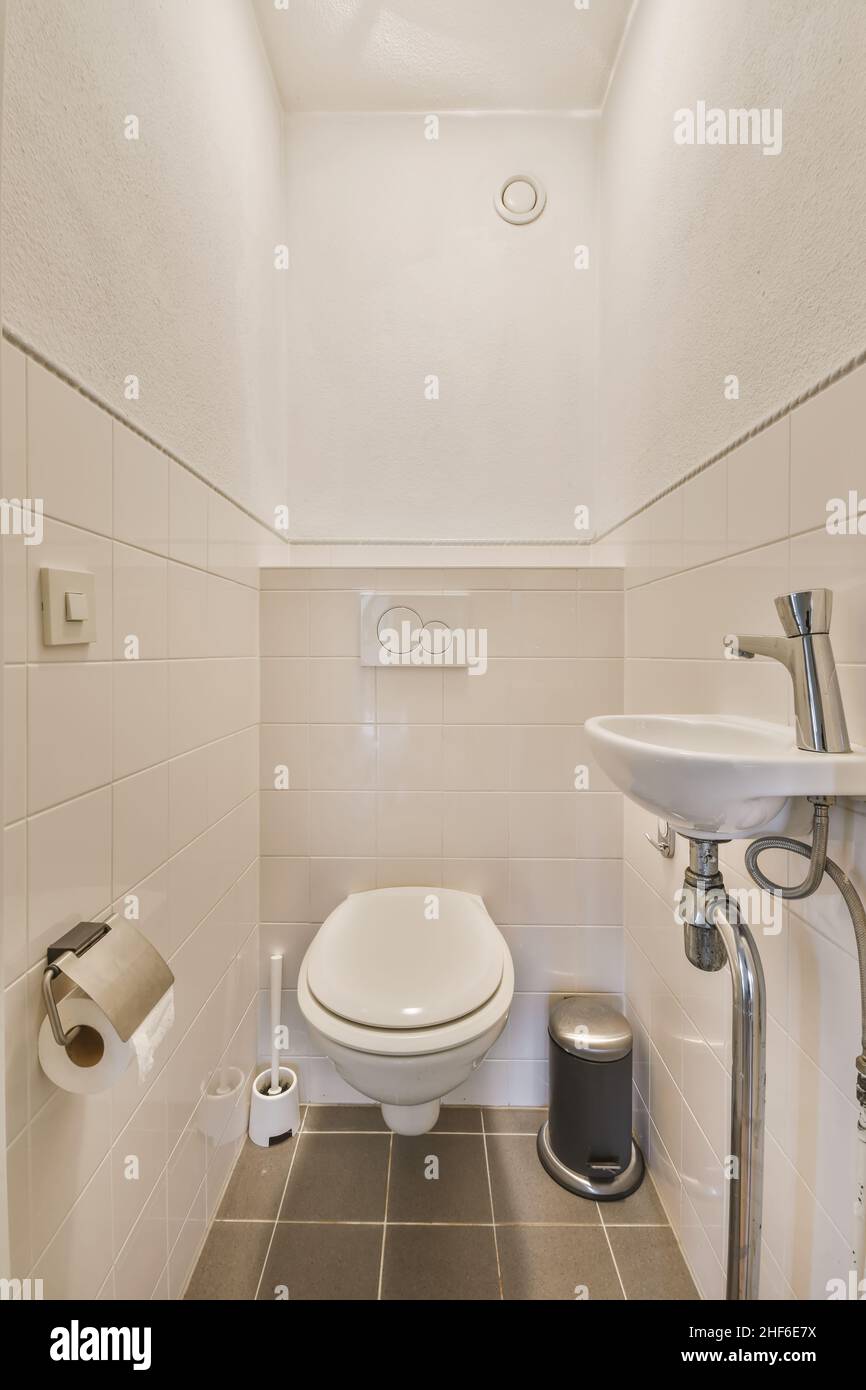 Interior of small clean restroom in miniature style Stock Photo - Alamy