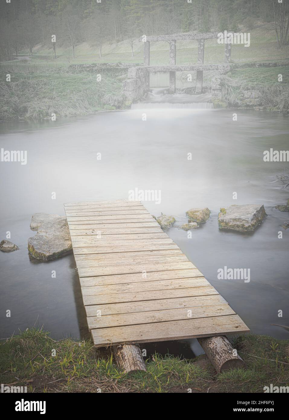 Water jetty in the fog Stock Photo - Alamy