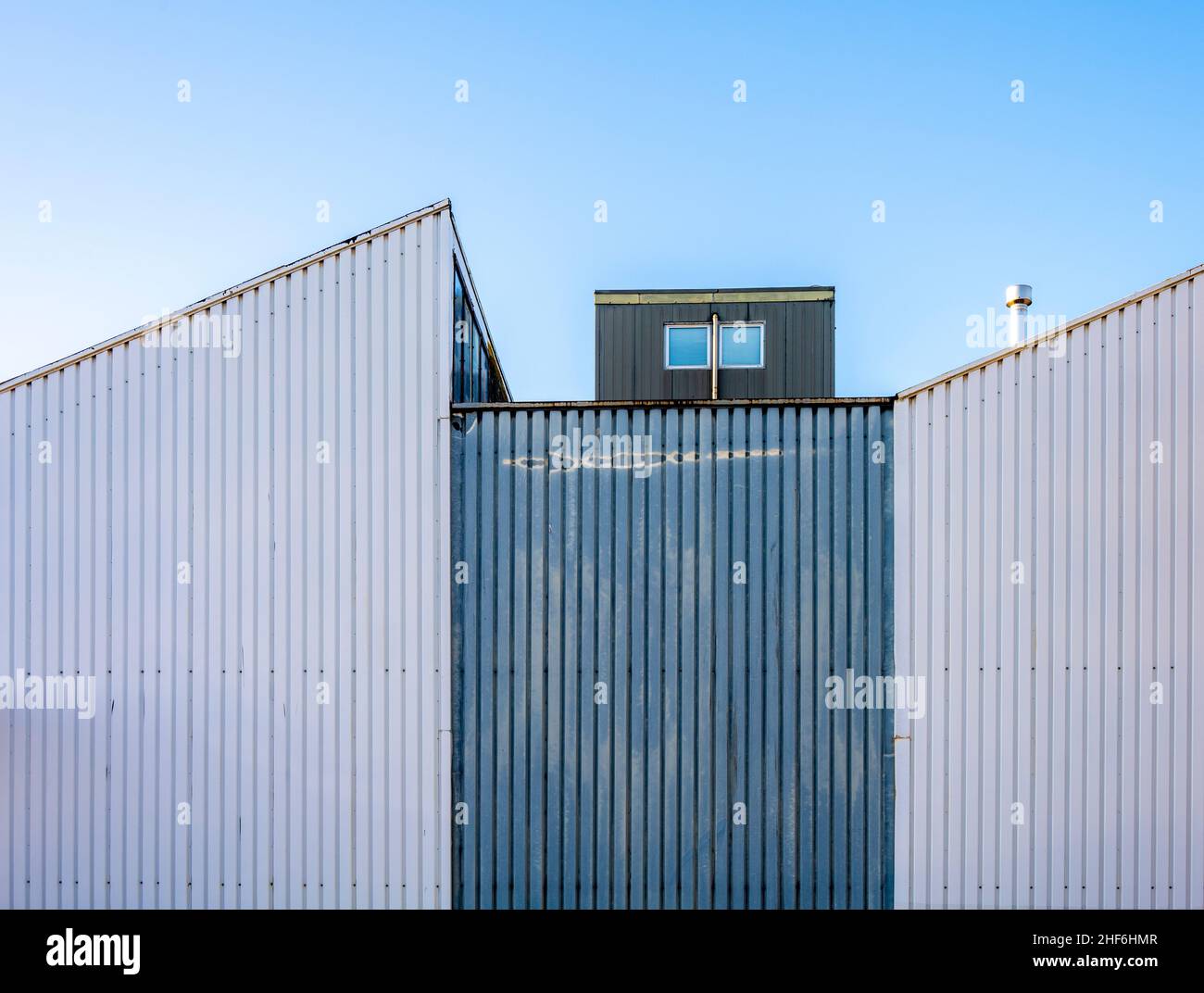 Warehouse, industrial area, blue sky Stock Photo - Alamy