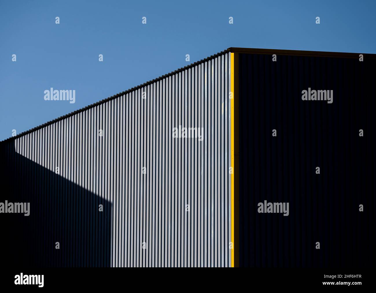 Warehouse, yellow stripe, industrial park, shadow, blue sky Stock Photo ...
