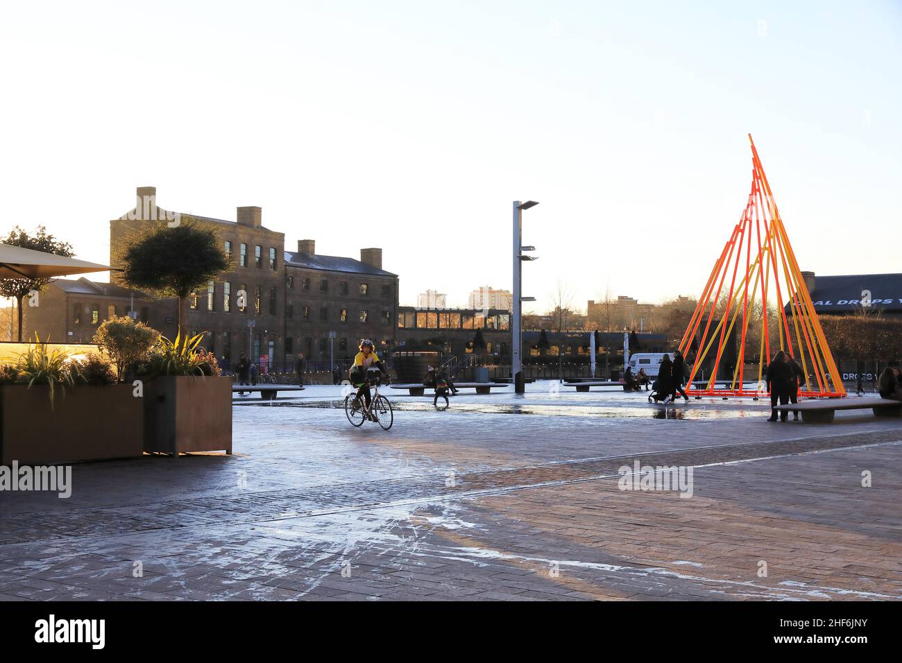 Winter sunshine setting on a quiet Granary Square in January 2022, with ...