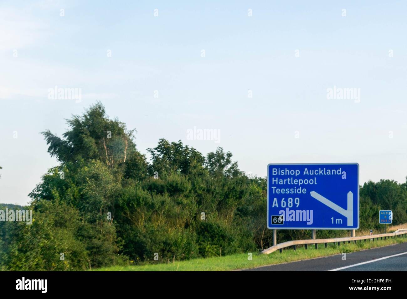 Blue road sign on a British, UK, motorway for junction 60 off the busy ...