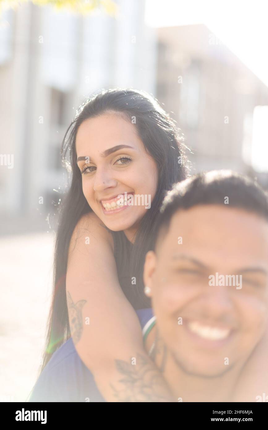 Valentines latin couple outdoor in the city or urban background smiling ...