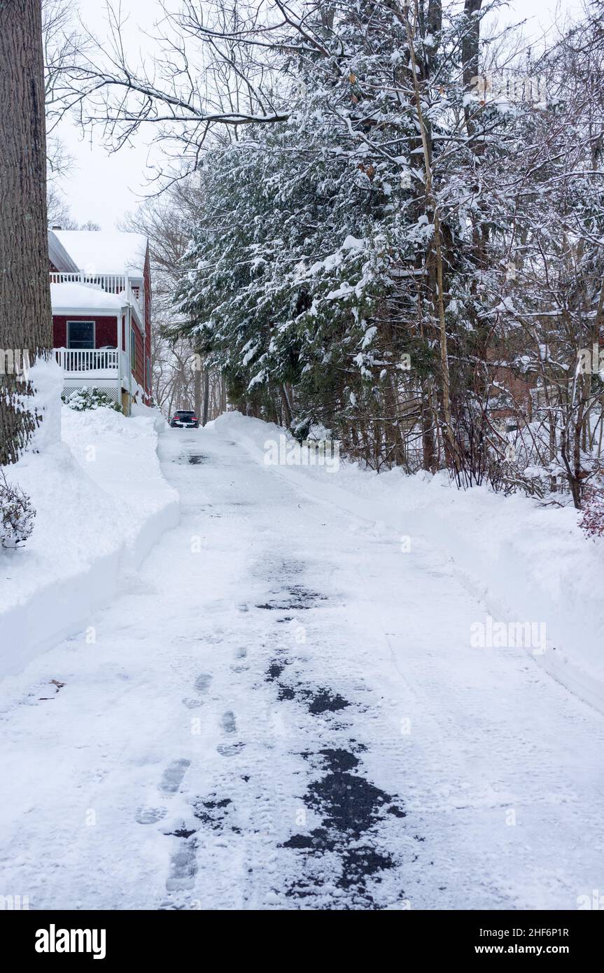 Red suburban house and driveway after the snow storm in February Stock ...