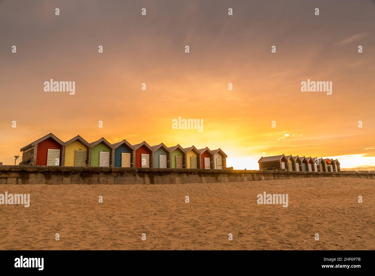 The vibrant and colorful beach huts by the promenade overlooking Blyth ...