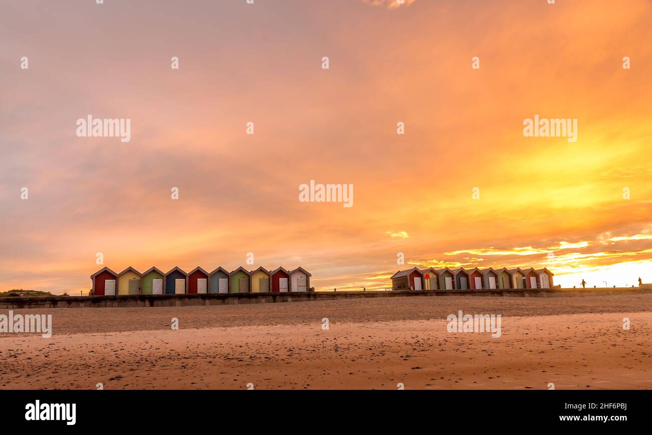 The vibrant and colorful beach huts by the promenade overlooking Blyth ...