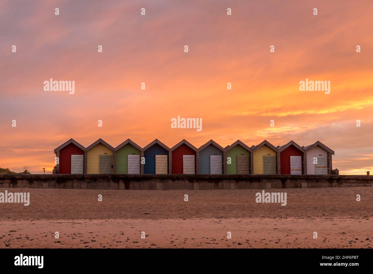 The vibrant and colorful beach huts by the promenade overlooking Blyth ...