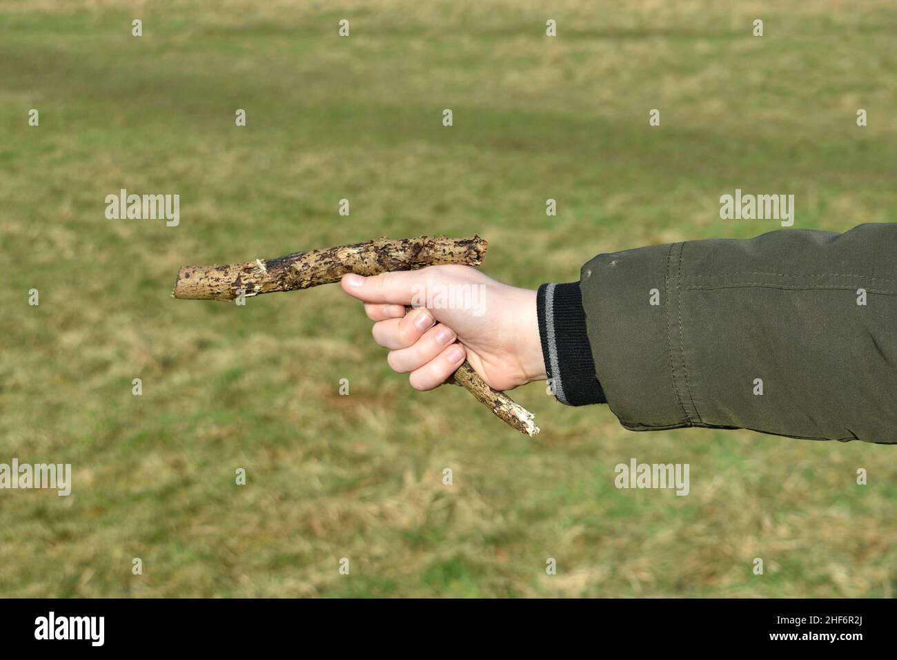 Hand holding pointing stick hi-res stock photography and images - Alamy
