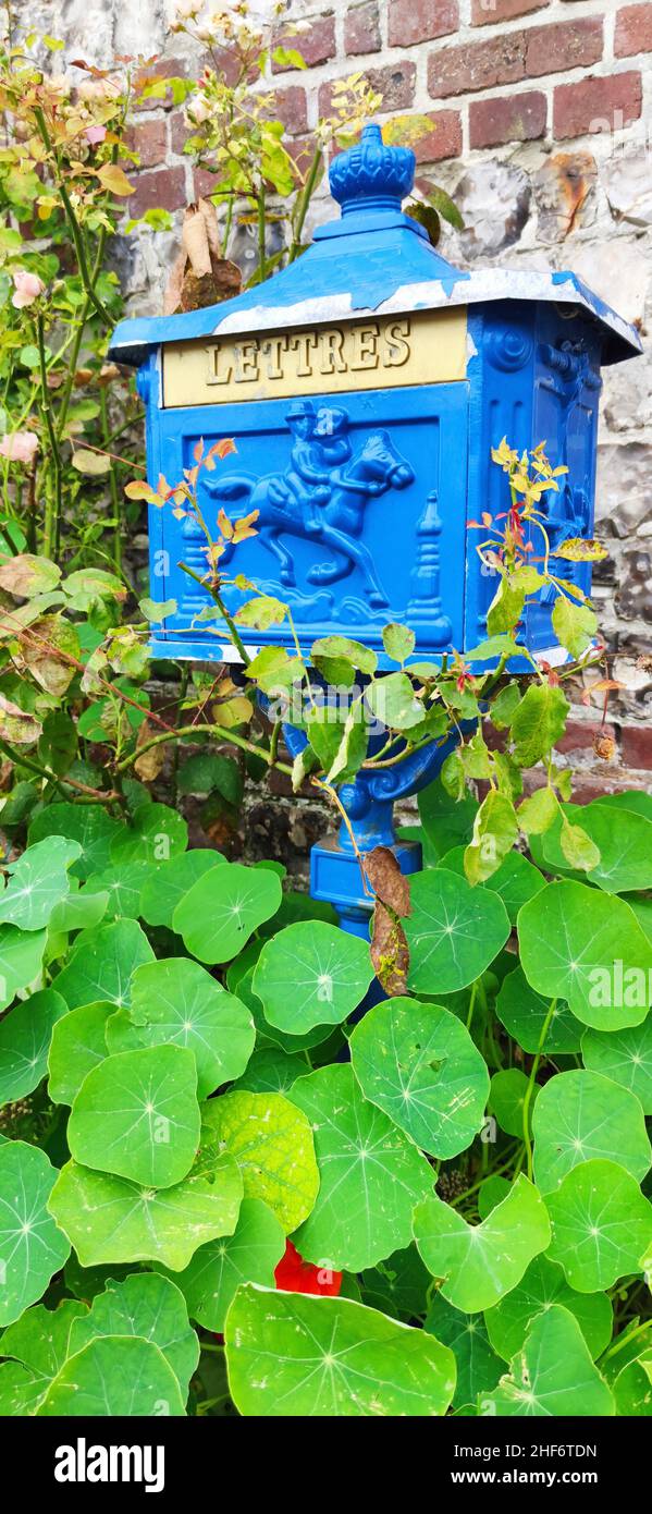 blue mailbox in front of brick wall France, Normandy Stock Photo - Alamy