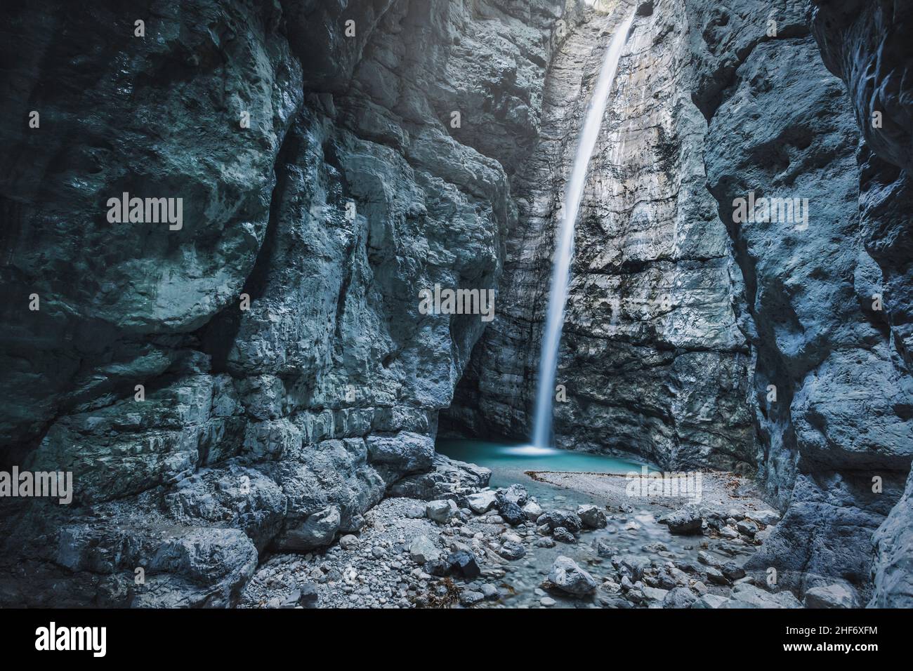 A natural waterfall at the bottom of the gorge of the Val di Piero ...