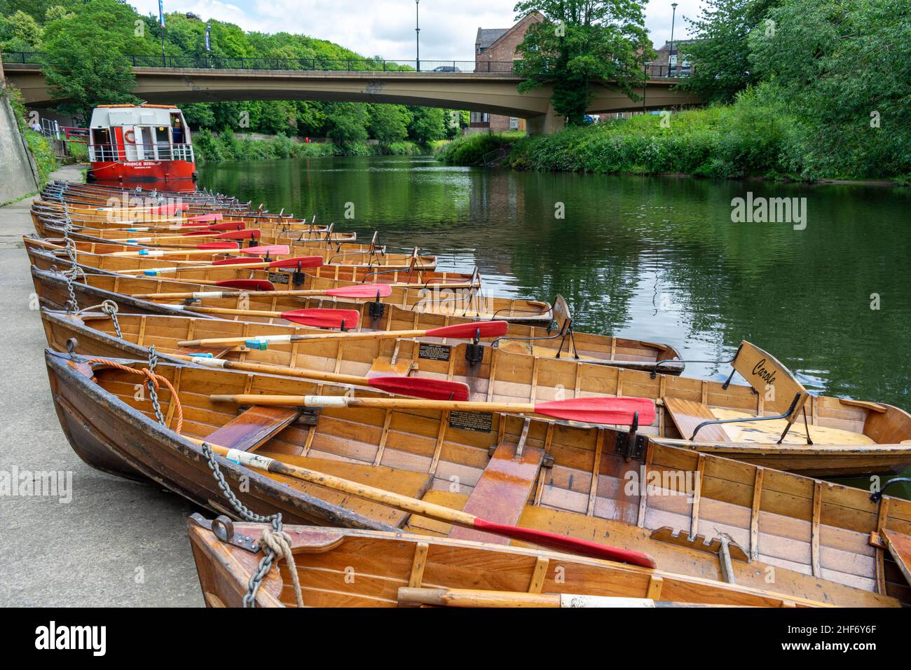 Rowing boats lined up on the Wear river in the city centre of Durham ...